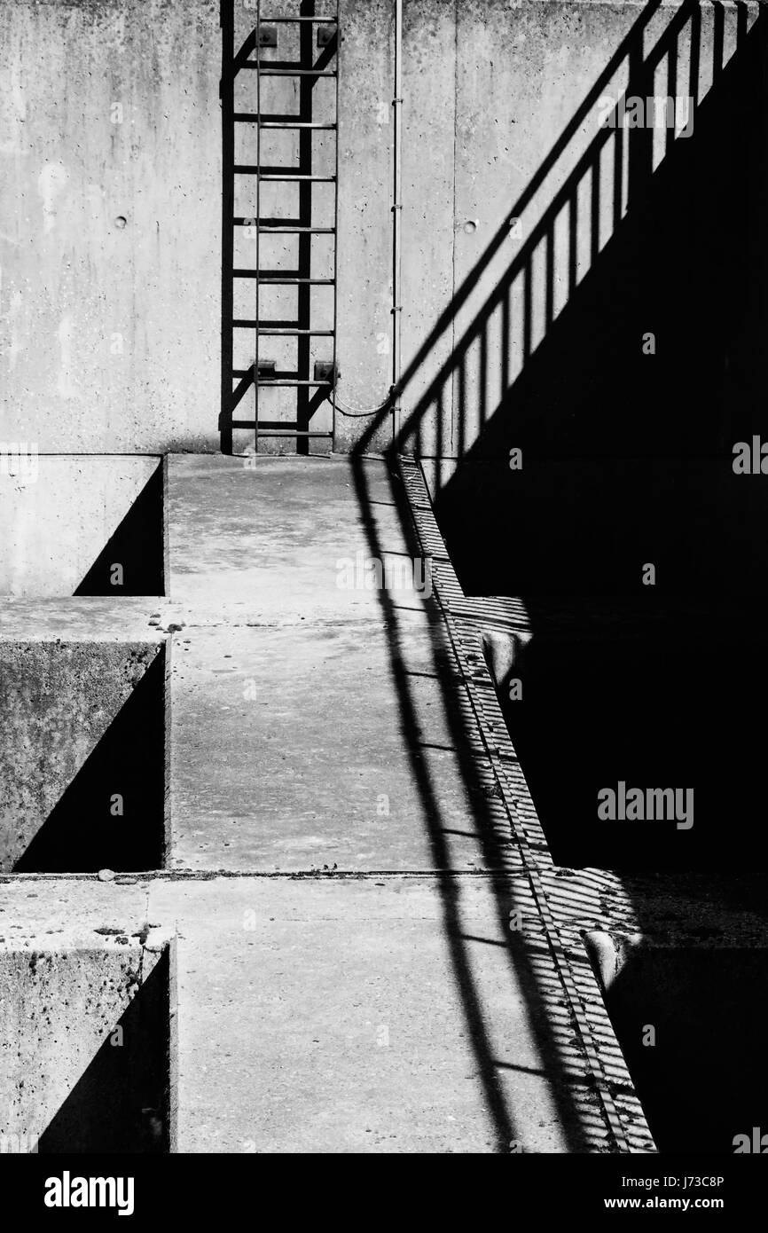 concrete railing ladder shaddow shadow pelvis basin shadows sign signal ...