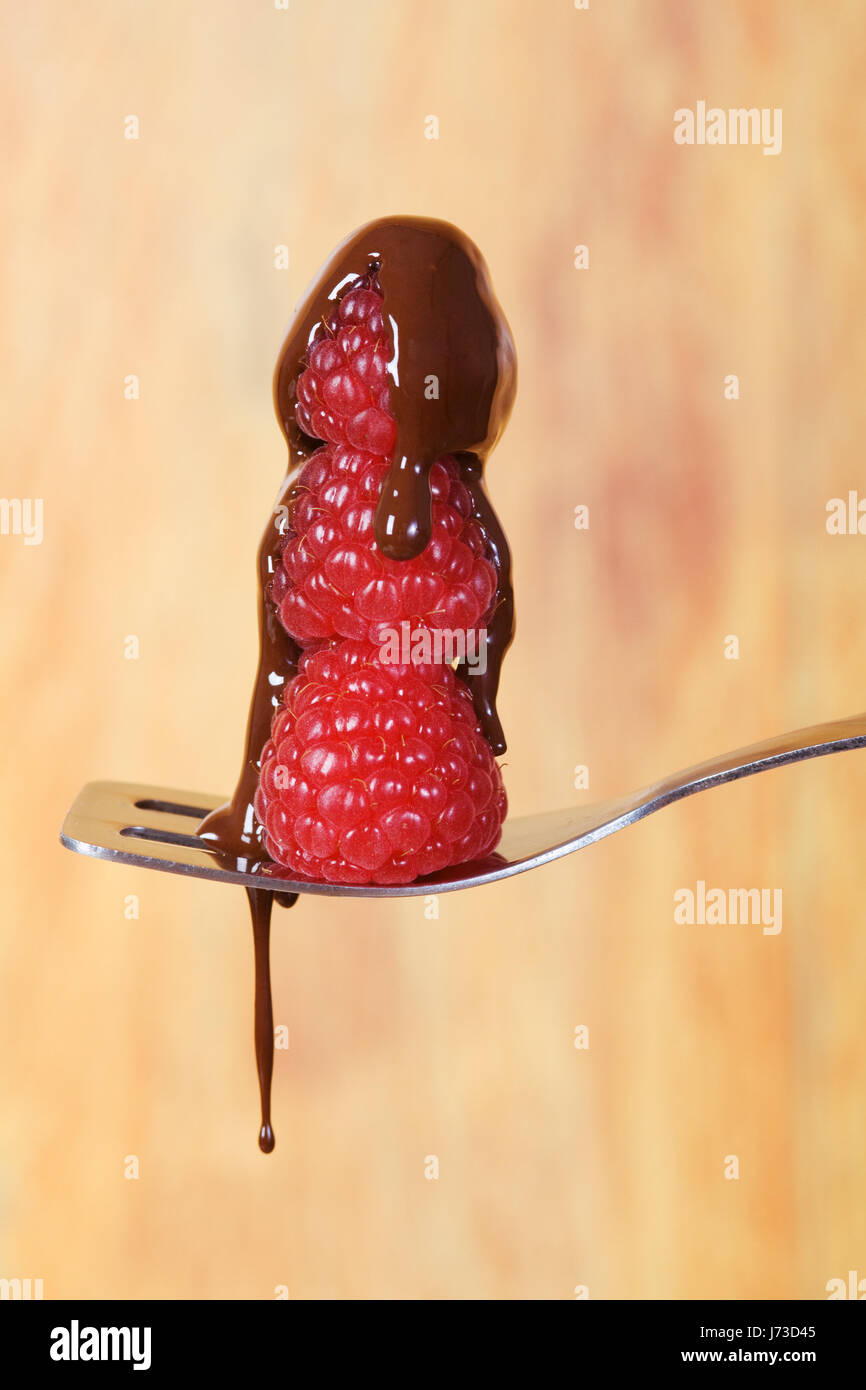 three raspberries with cast Stock Photo - Alamy