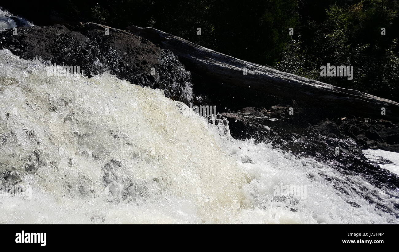 Splashing water in a river Stock Photo - Alamy