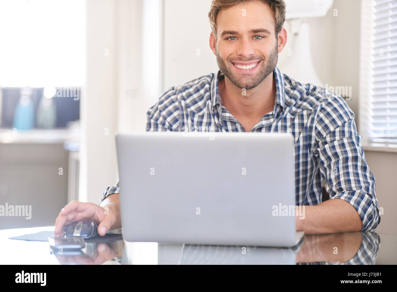 bright cropped image of handsome young man smiling at camera Stock ...