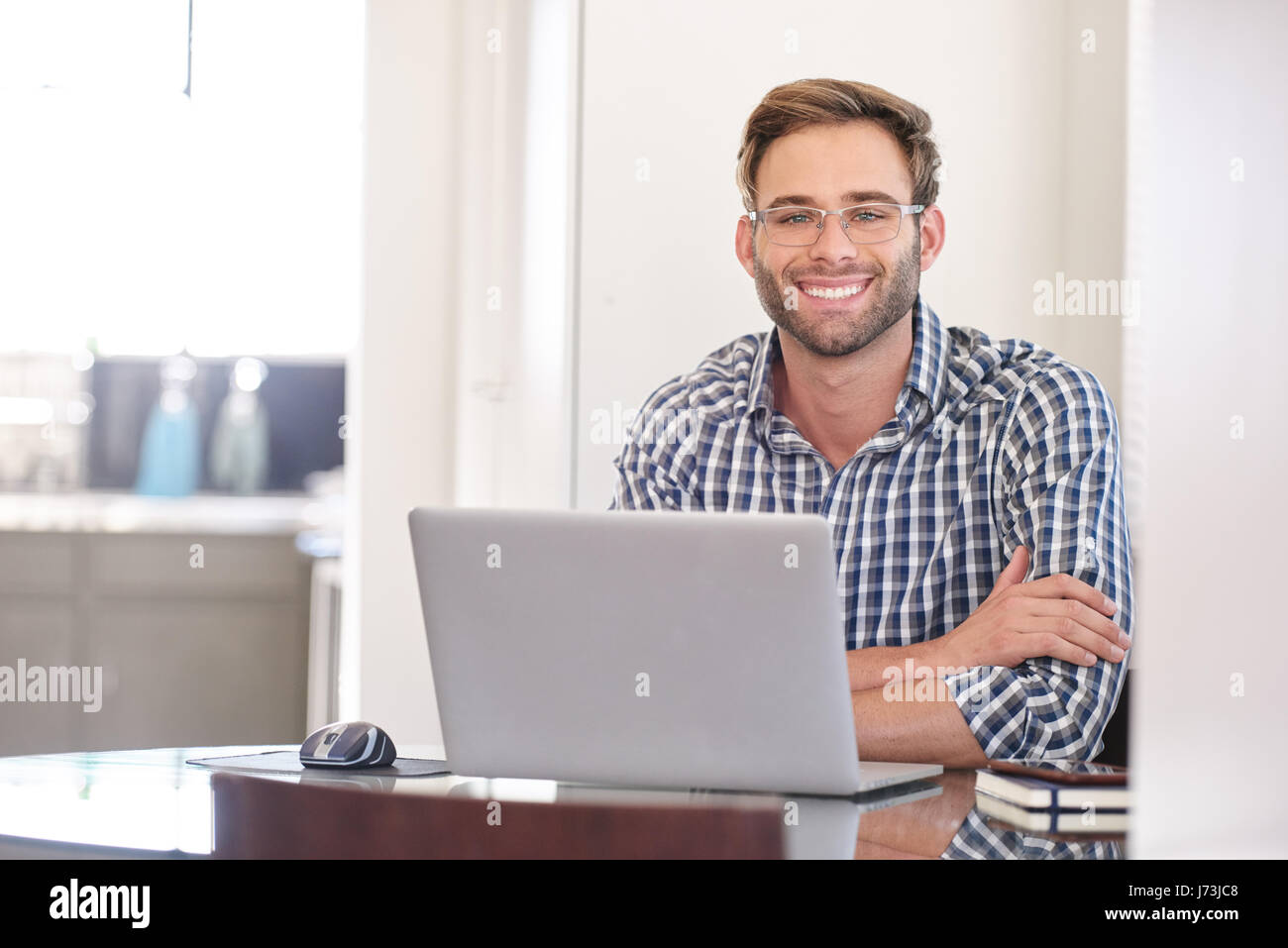Handsome groomed caucasian accountant smiling while looking at camera ...