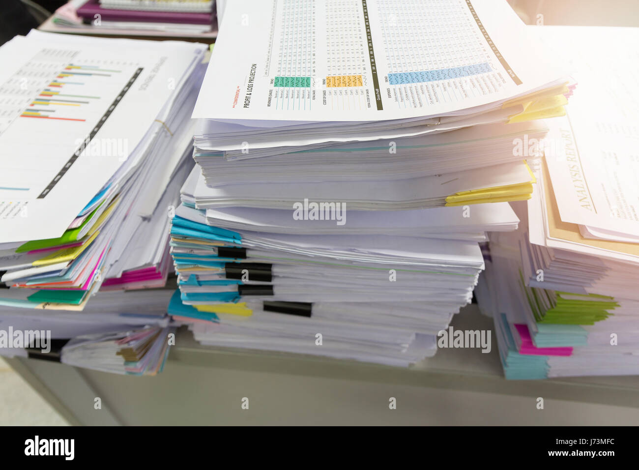 Pile of unfinished documents on office desk, Stack of business paper ...