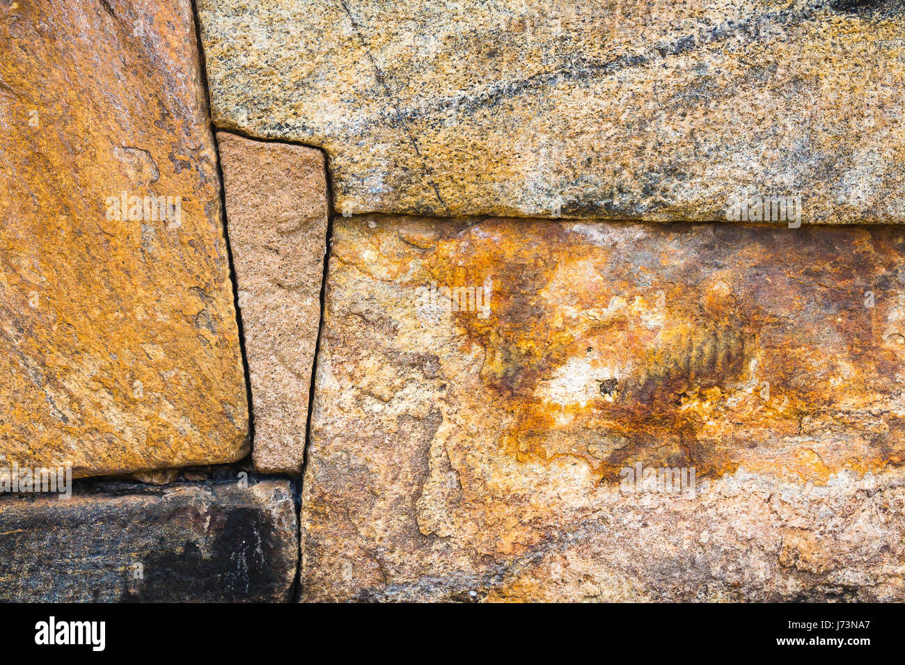 An ancient stone wall construction with perfectly interlocking stones ...