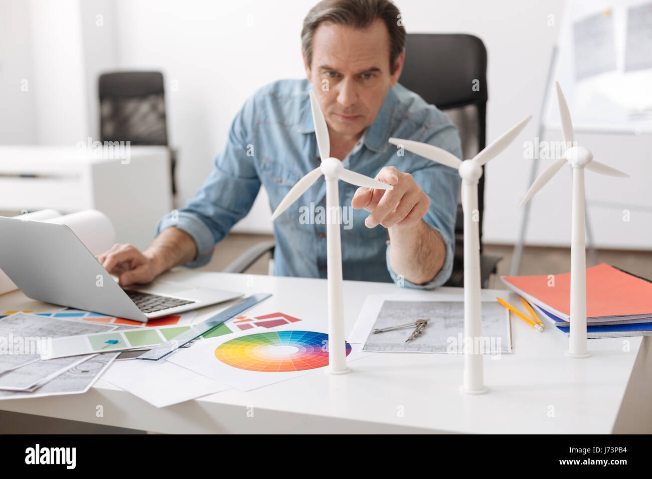 Professional engineer working on the project of building wind turbines ...