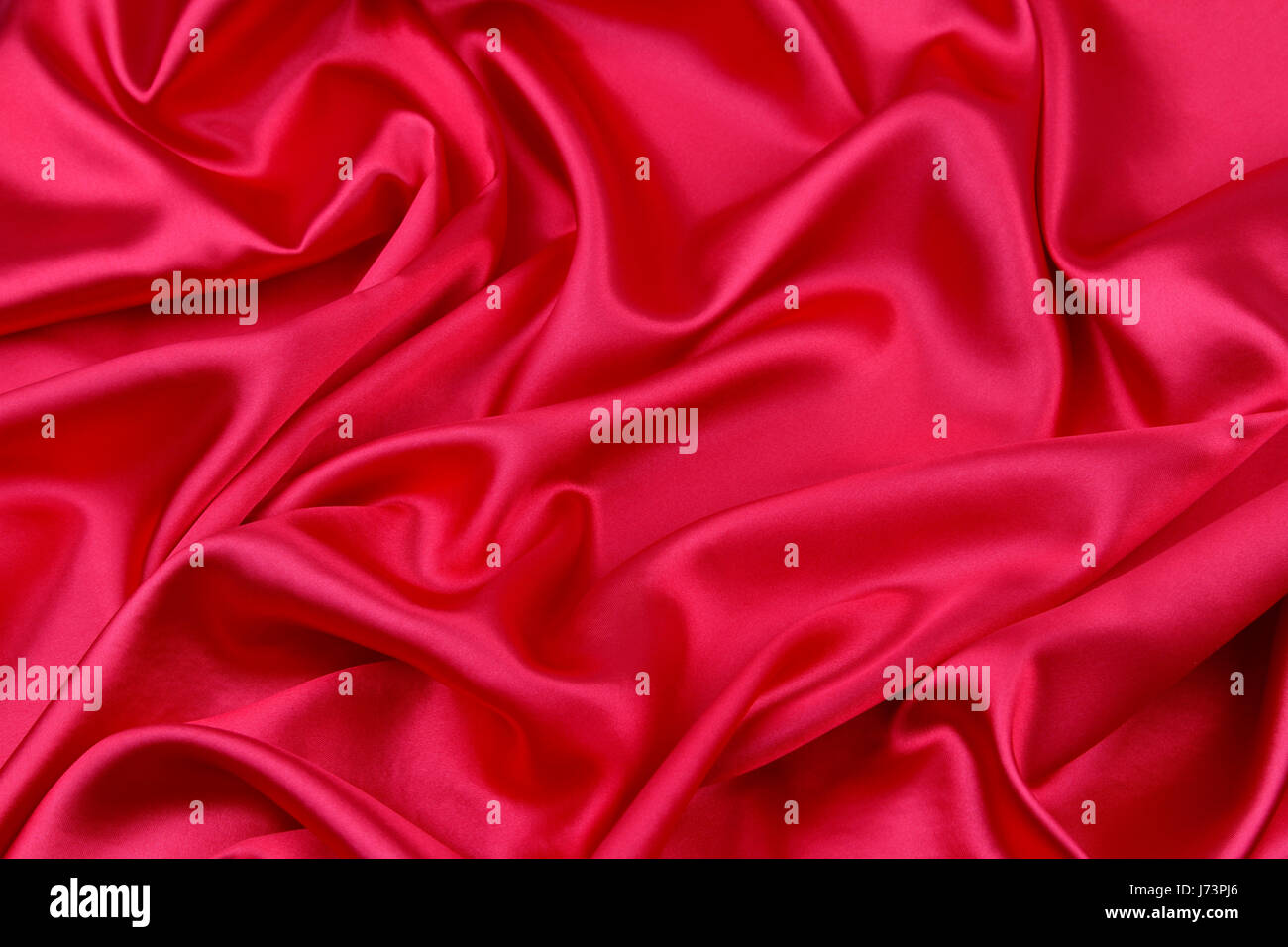 Closeup of ripples in red silk fabric Stock Photo - Alamy
