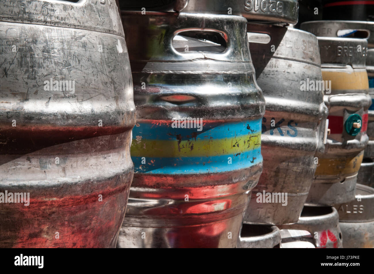 Beer kegs used to store drinks stacked up Stock Photo - Alamy