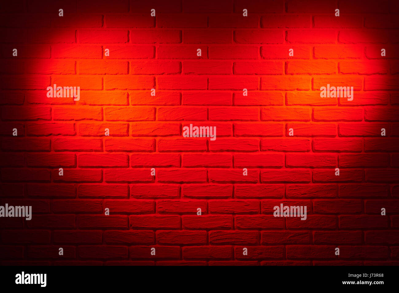 dark red brick wall with heart shape light effect and shadow, abstract ...