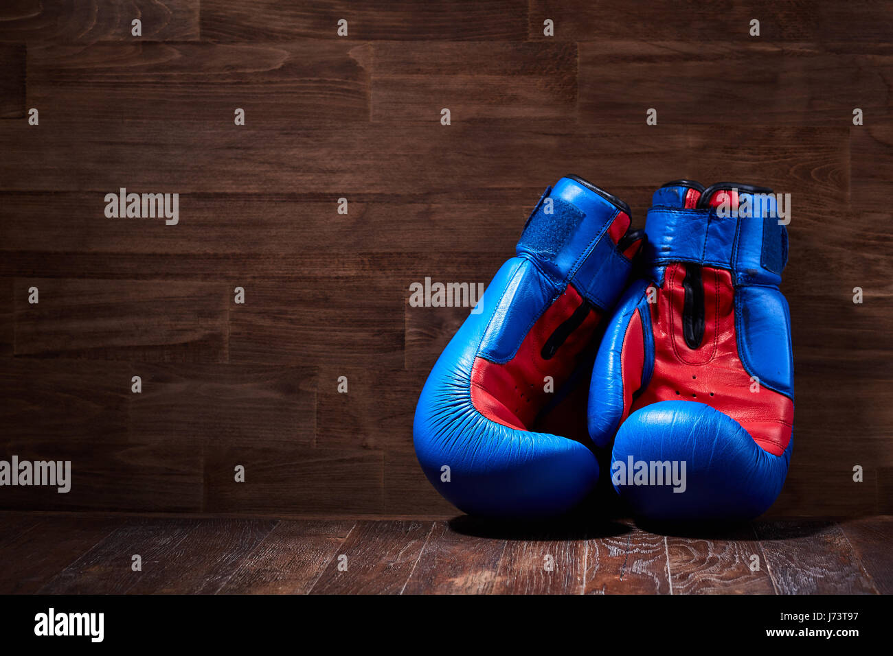 Boxing background with two gloves on the brown plank background Stock ...