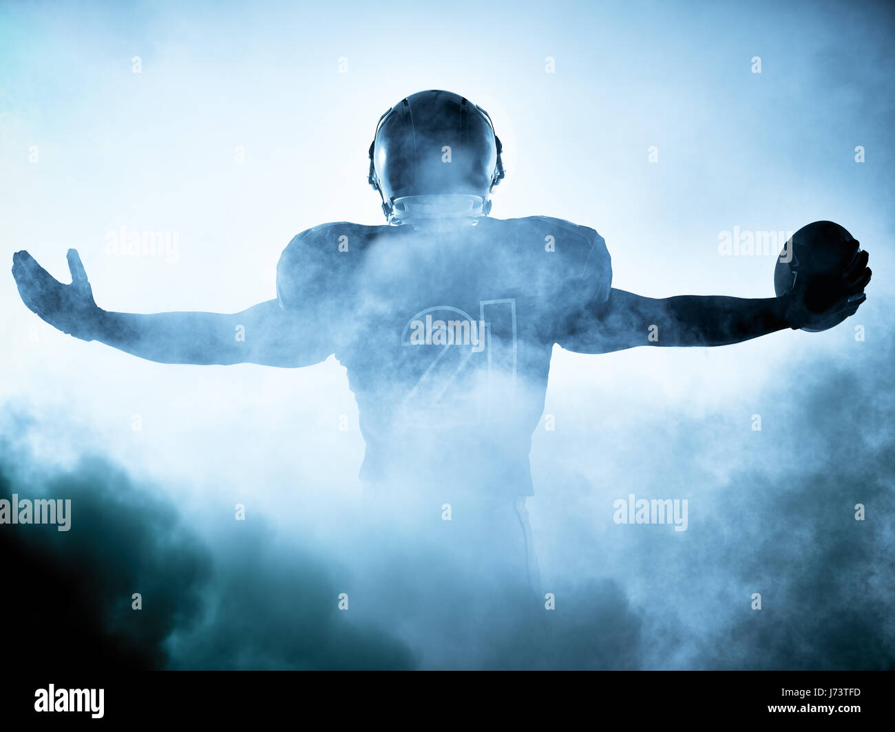 one american football player portrait in silhouette shadow on white ...