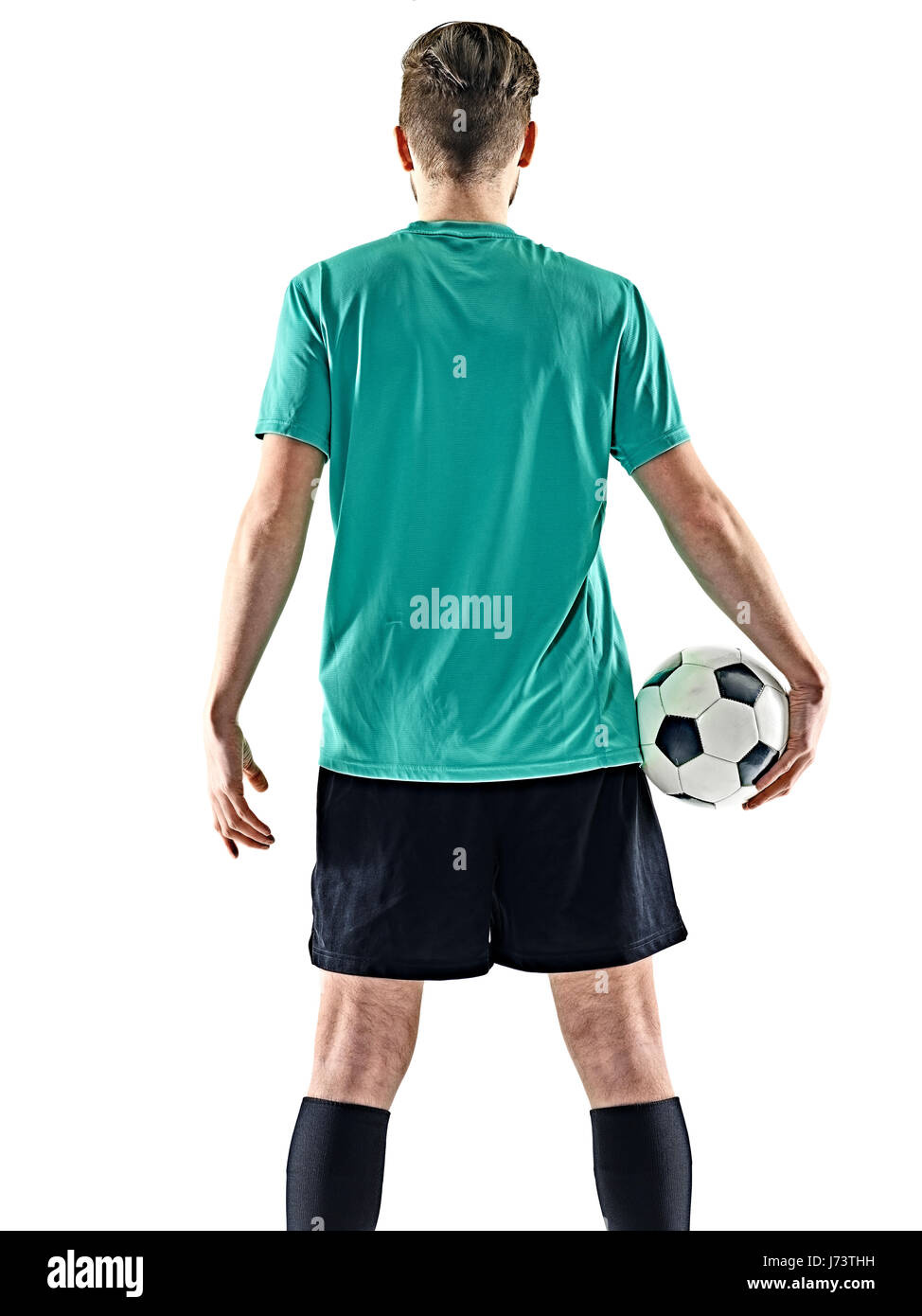 one caucasian soccer player man standing Rear View holding football ...