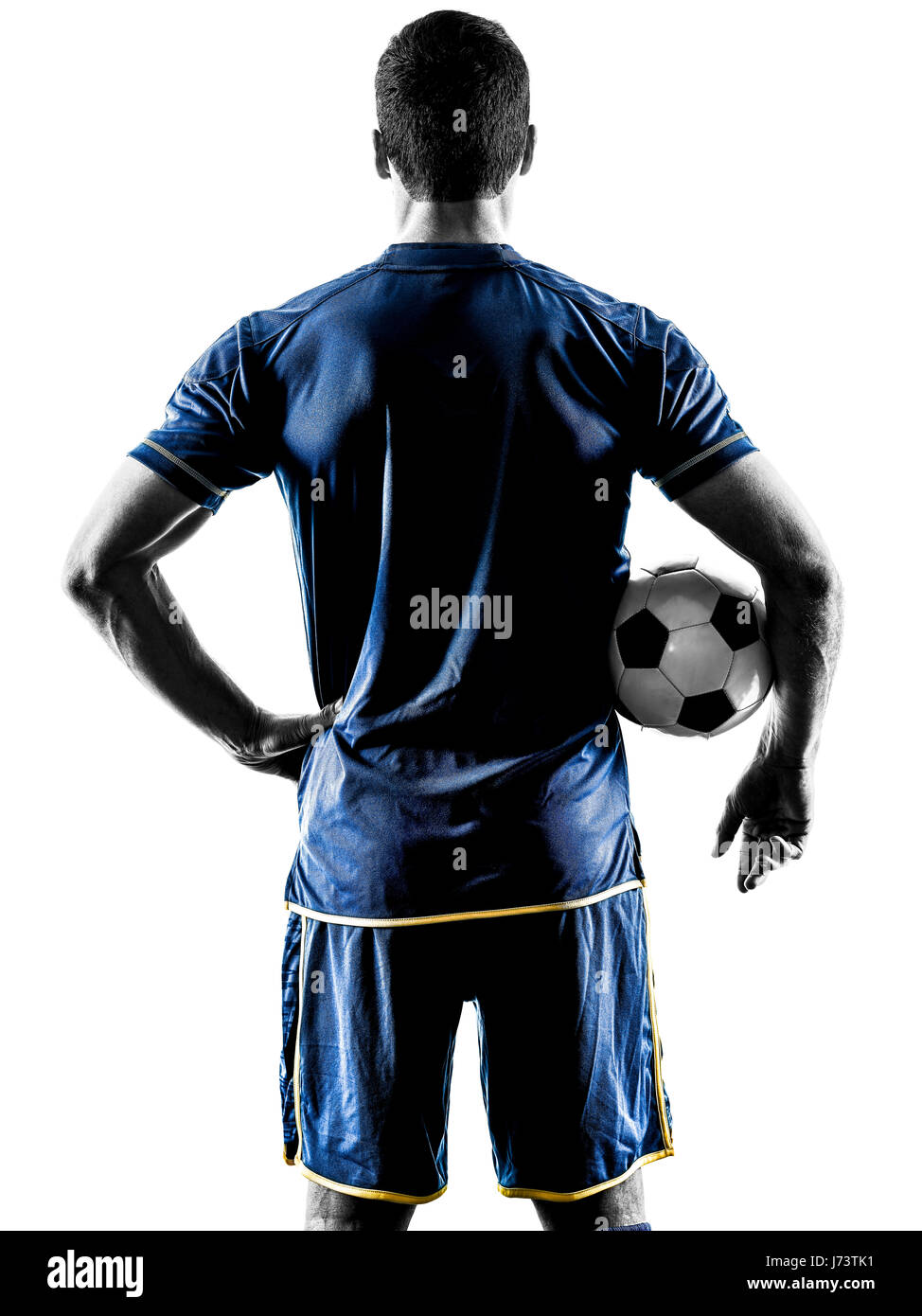 one caucasian soccer player man standing Rear View in silhouette ...