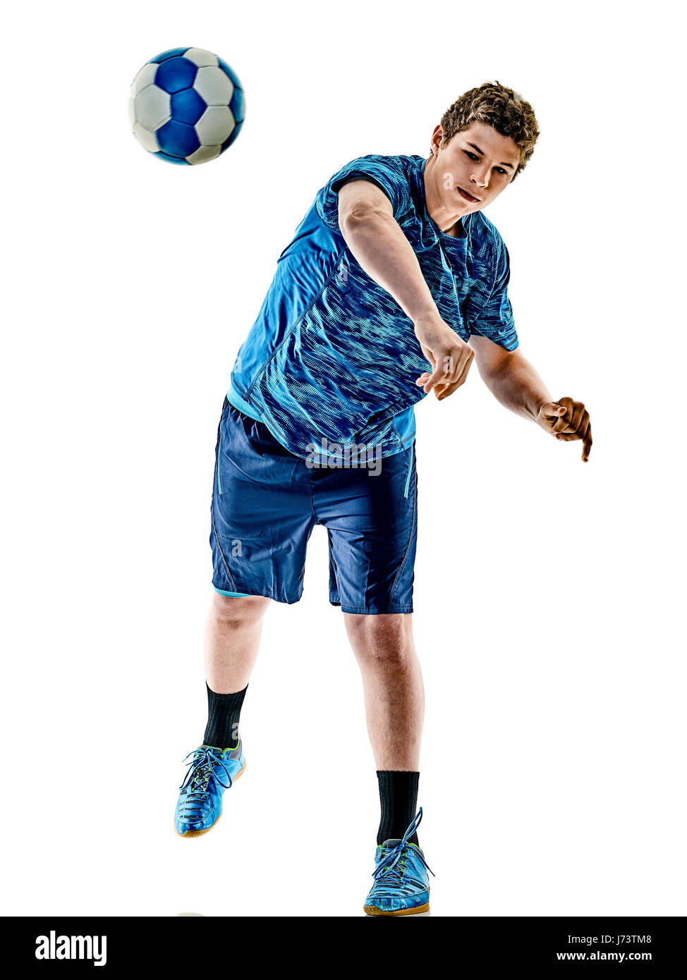 one caucasian handball player teenager boy in studio isolated on white ...