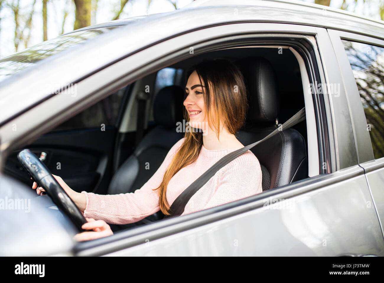 Young woman driving her car safe drive Stock Photo - Alamy