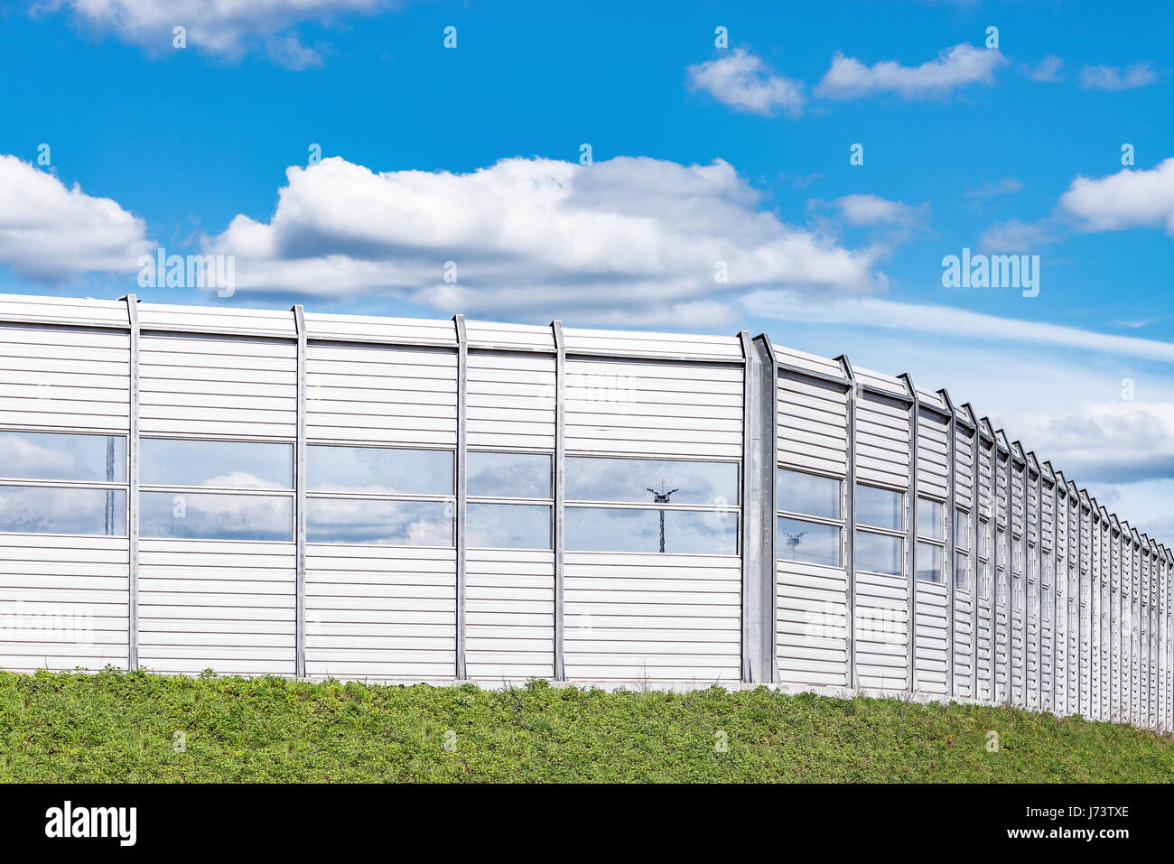 Noise protection fence along the new highway Stock Photo - Alamy