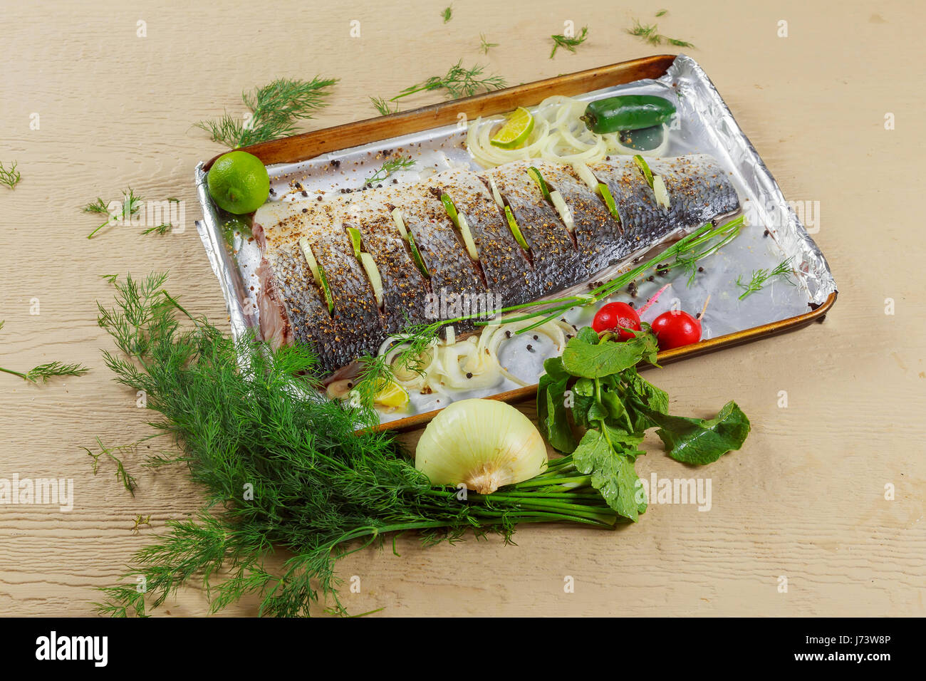 Marinated fried fish fry with spices n lemon filets in oil with lemon ...
