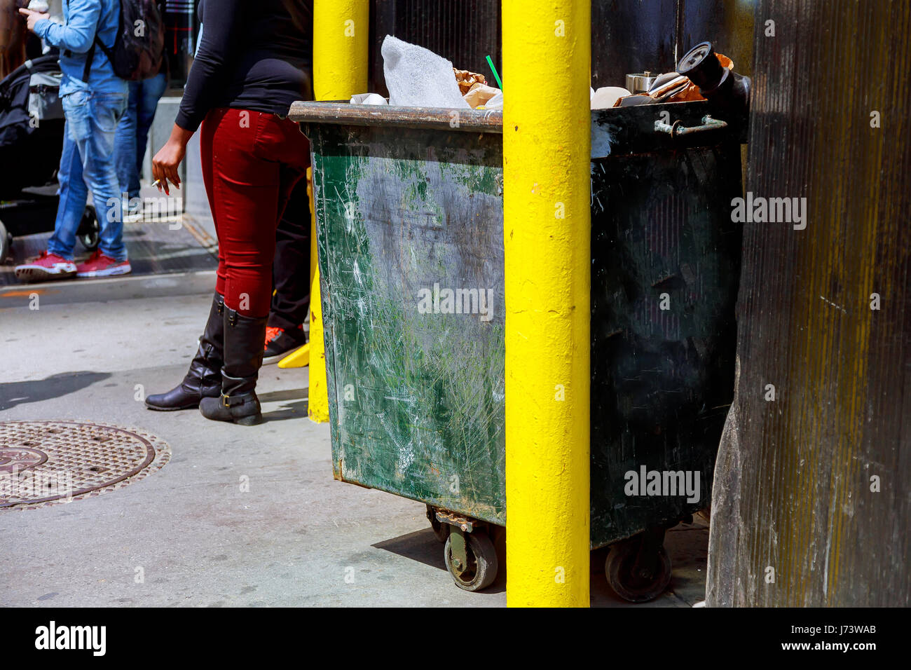 Tank bins on sidewalk garbage containers NY NEWYORK Stock Photo - Alamy
