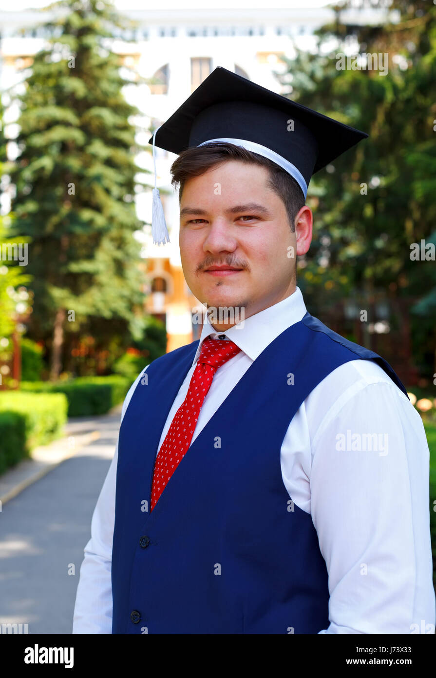 Happy graduateing student wearing graduation hat Stock Photo - Alamy