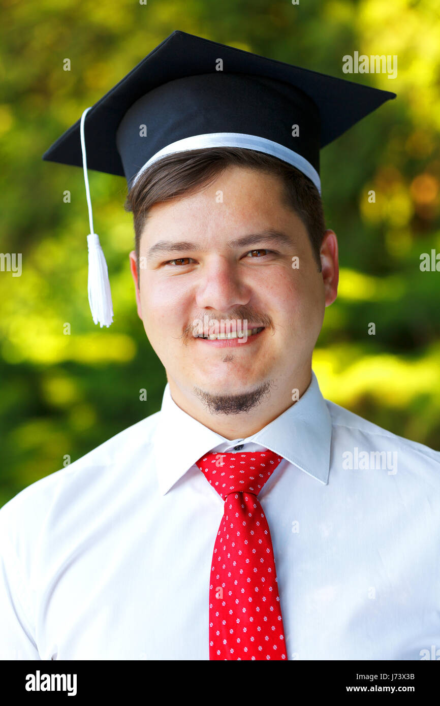 Happy graduateing student wearing graduation hat Stock Photo - Alamy