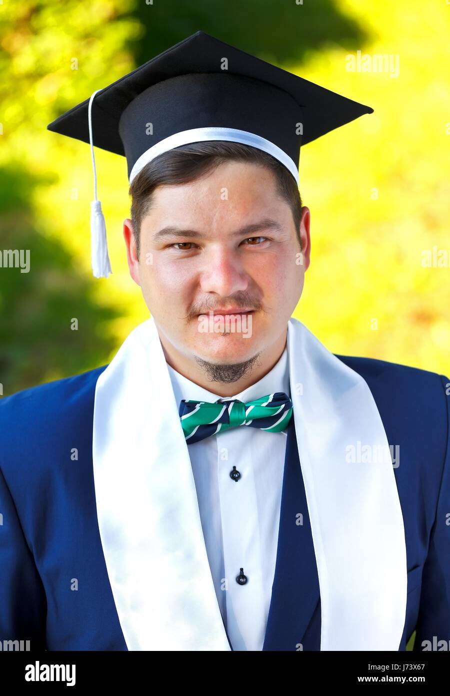 Happy graduateing student wearing graduation hat Stock Photo - Alamy