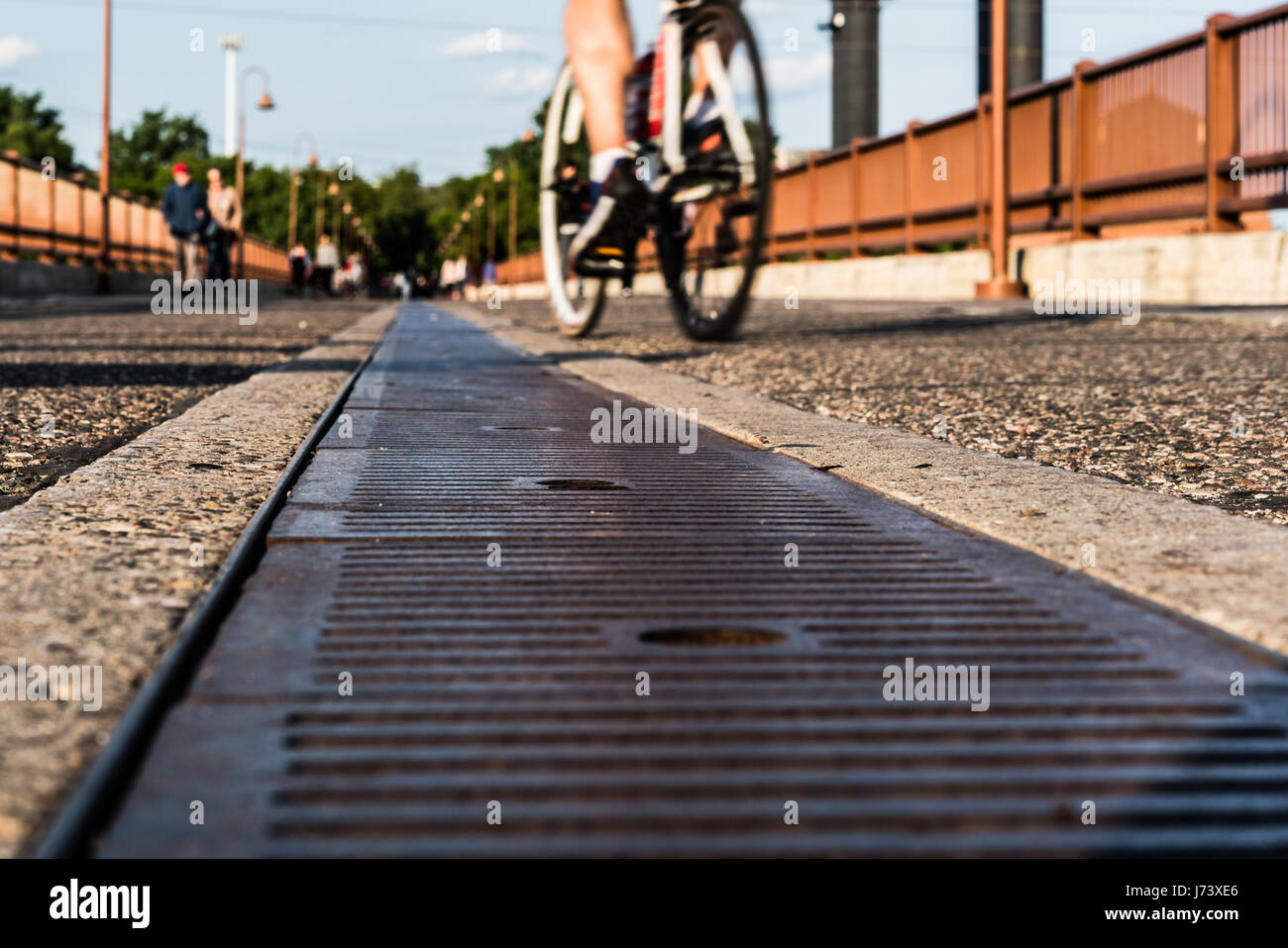 A cyclist rides the biking path at the Stone Arch Bridge in Minneapolis ...