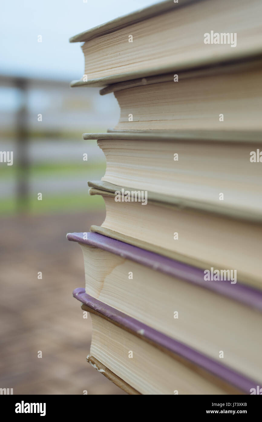 Stack old books, extreme closeup. Selective focus, vertical composition ...