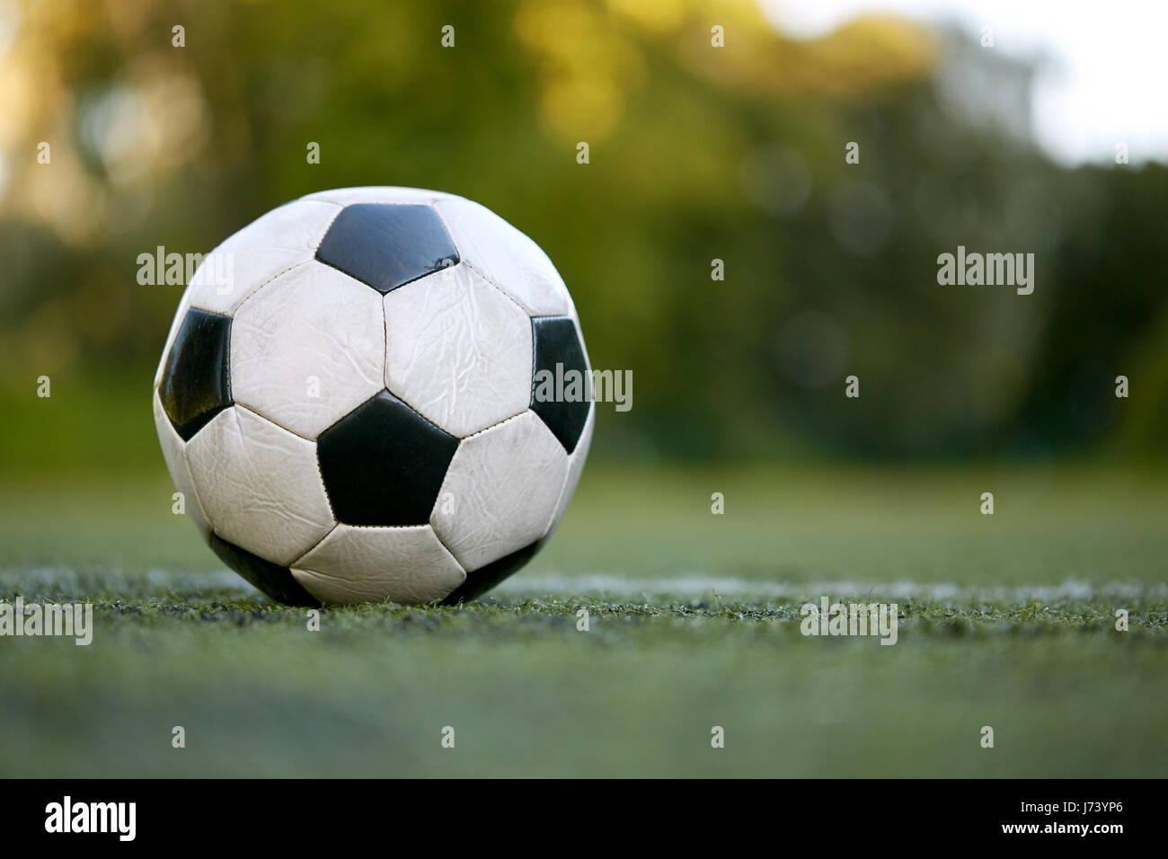 soccer ball on football field marking line Stock Photo - Alamy