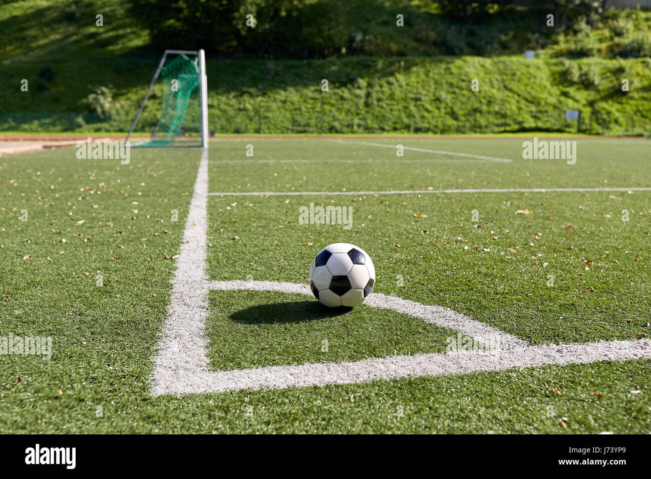 soccer ball on football field Stock Photo - Alamy