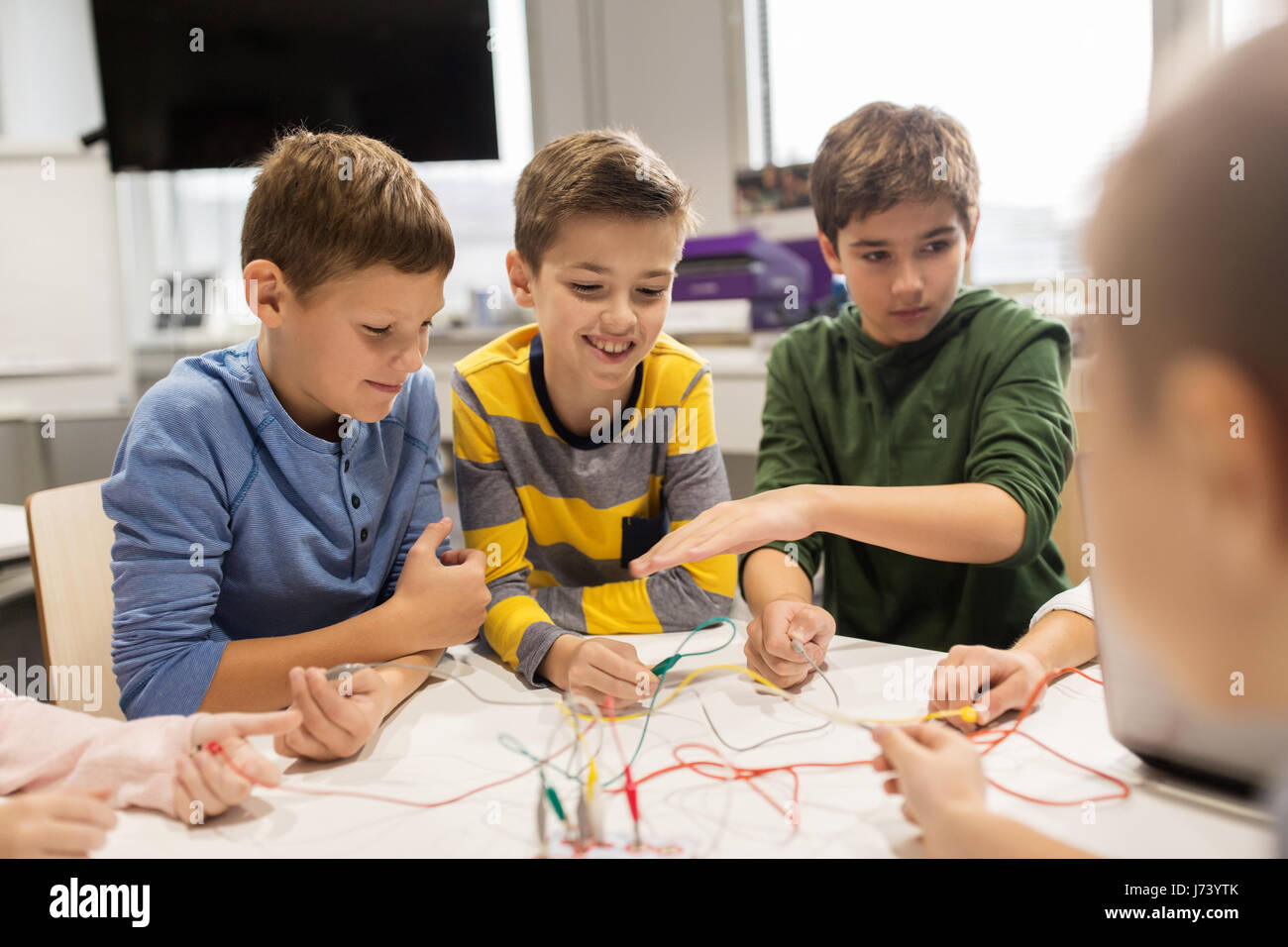happy kids with invention kit at robotics school Stock Photo - Alamy