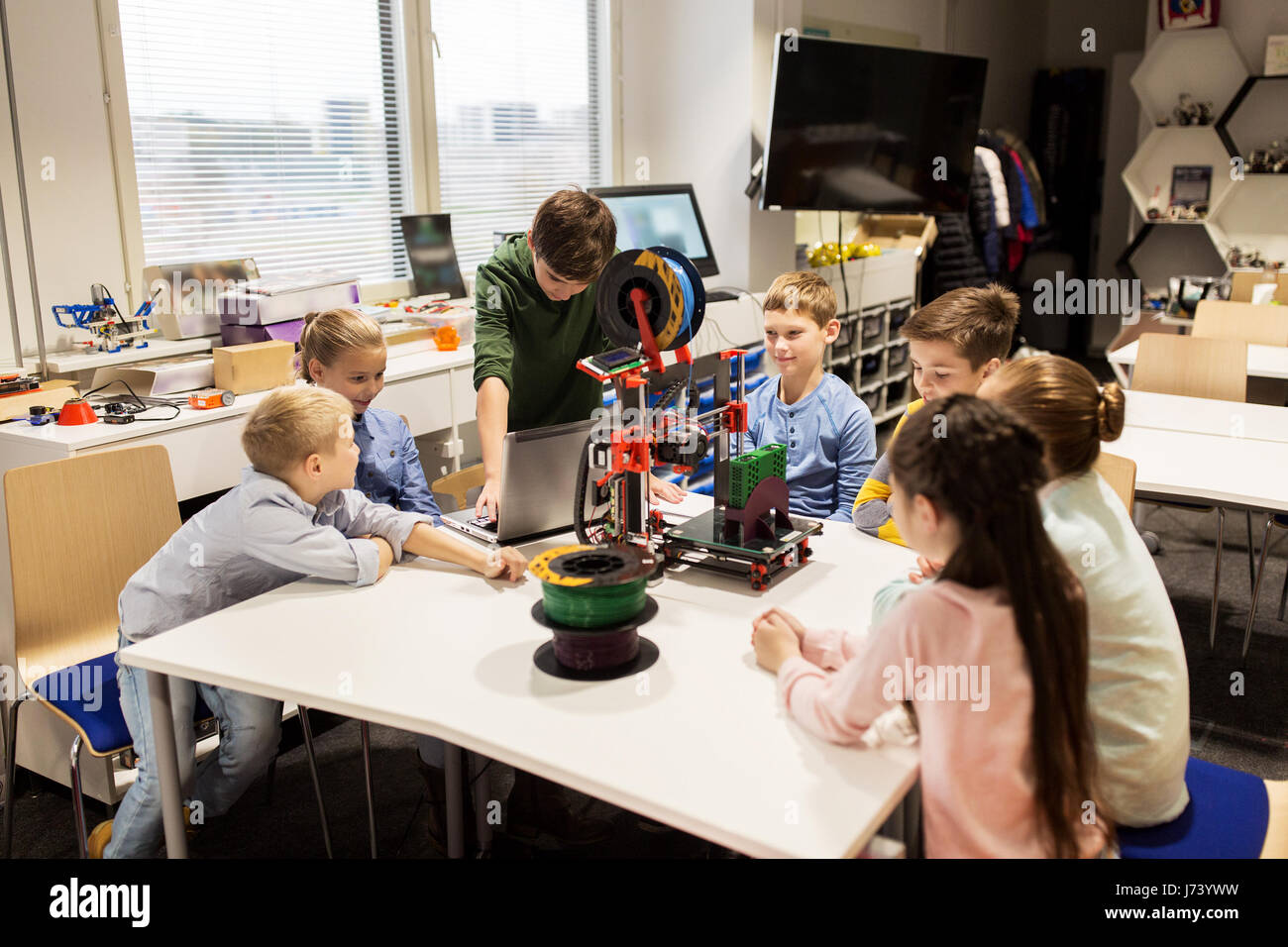 happy children with 3d printer at robotics school Stock Photo - Alamy