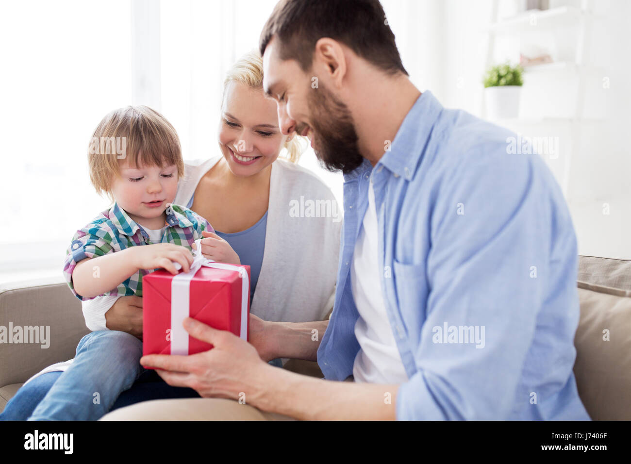 happy family with birthday gift at home Stock Photo - Alamy
