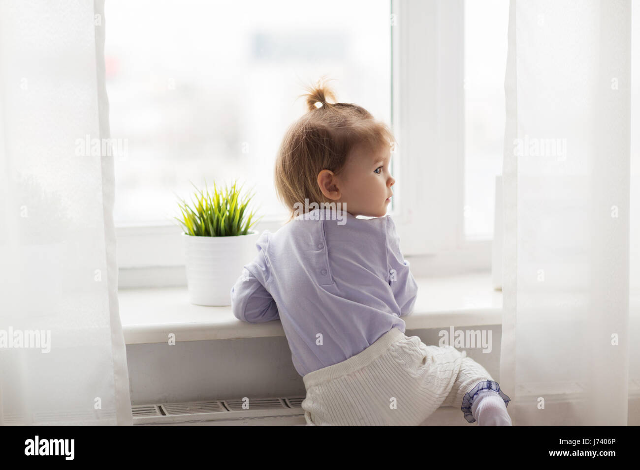 lovely little girl at home window Stock Photo - Alamy