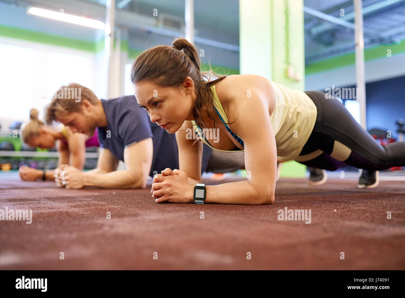 woman with heart-rate tracker exercising in gym Stock Photo - Alamy