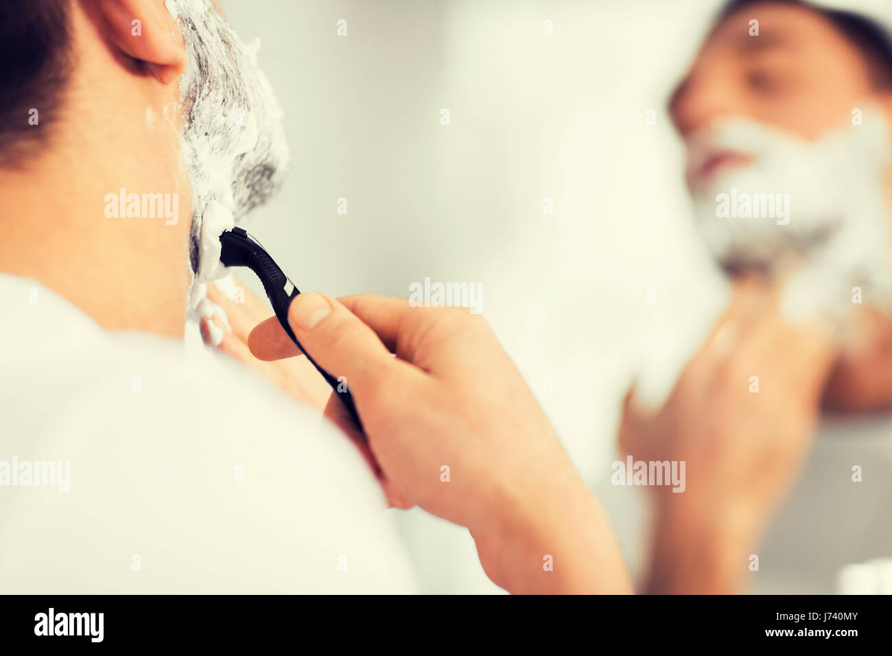 close up of man shaving beard with razor blade Stock Photo - Alamy