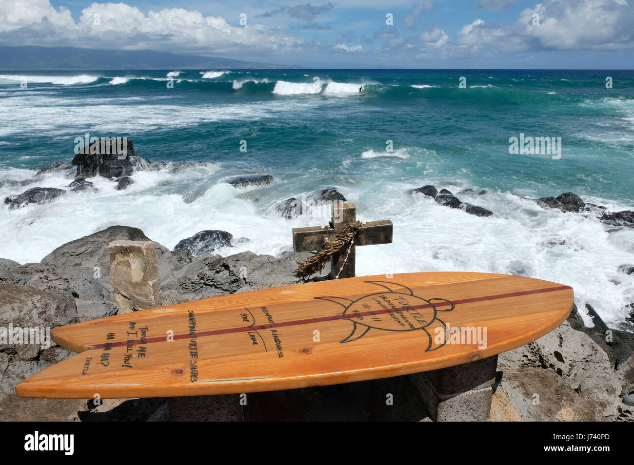 Wooden surf board and stone cross, a memorial to surfer Tristan Brennan ...
