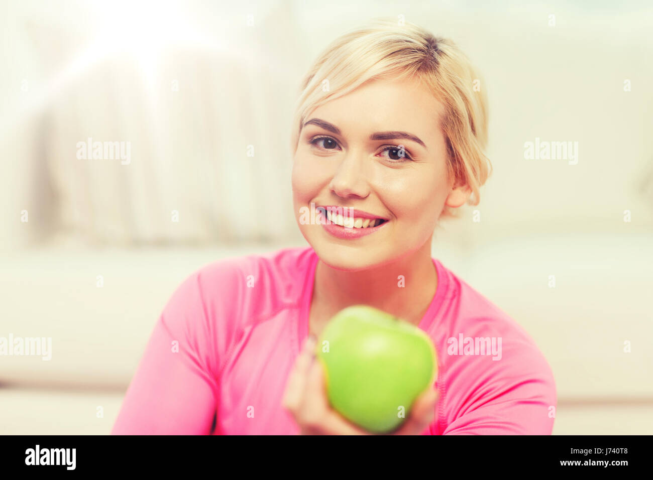 Woman eating an apple hi-res stock photography and images - Alamy