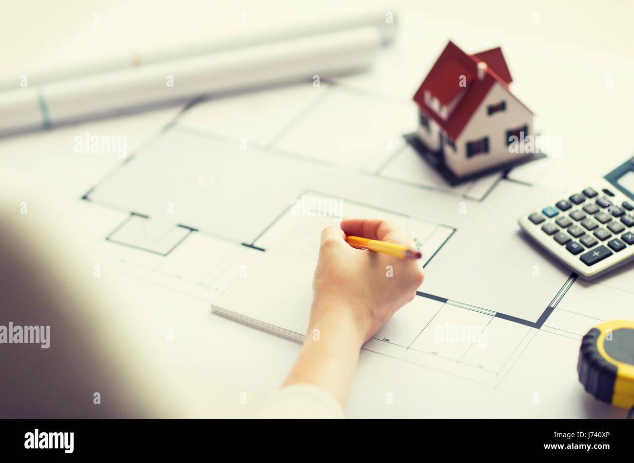 close up of hand on blueprint writing to notebook Stock Photo - Alamy