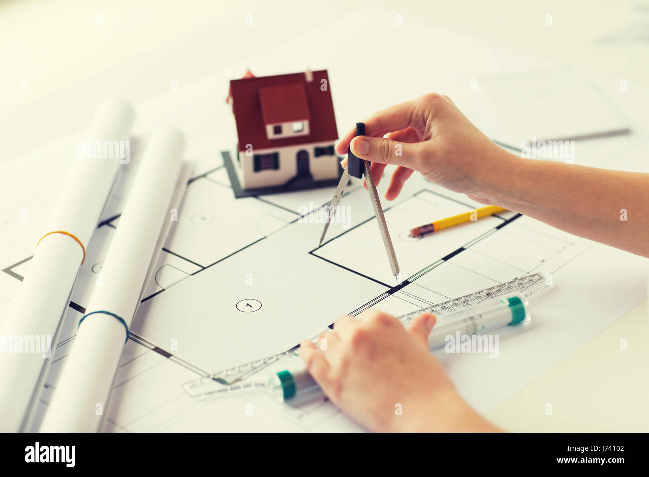 close up of hands with compass measuring blueprint Stock Photo - Alamy