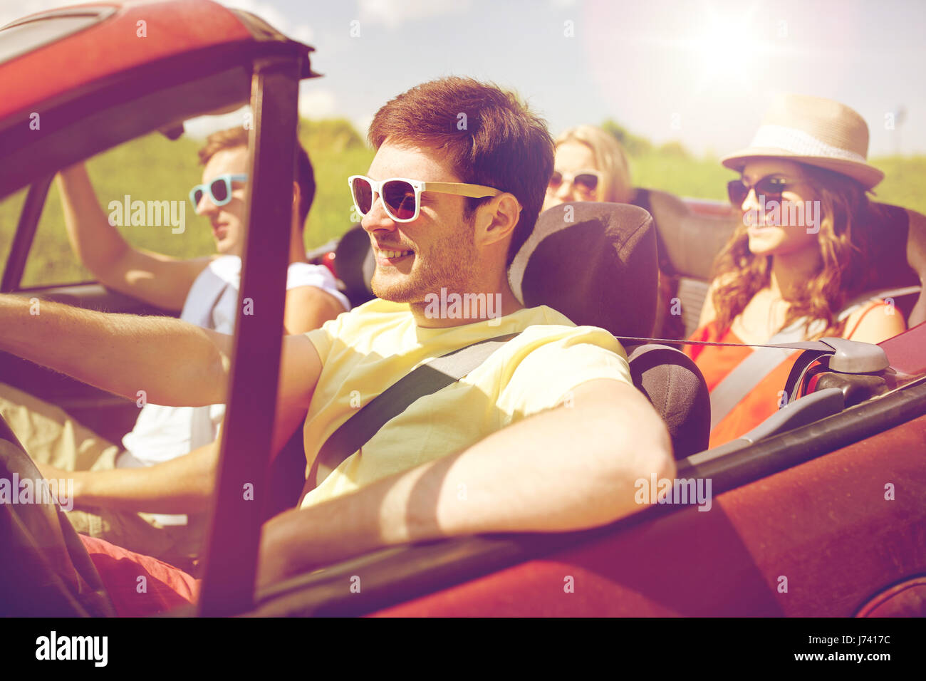 happy friends driving in cabriolet car Stock Photo - Alamy