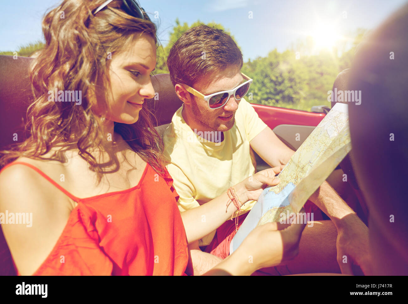 happy friends driving in cabriolet car Stock Photo - Alamy