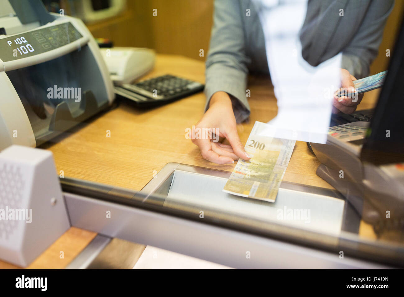 clerk counting cash money at bank office Stock Photo - Alamy
