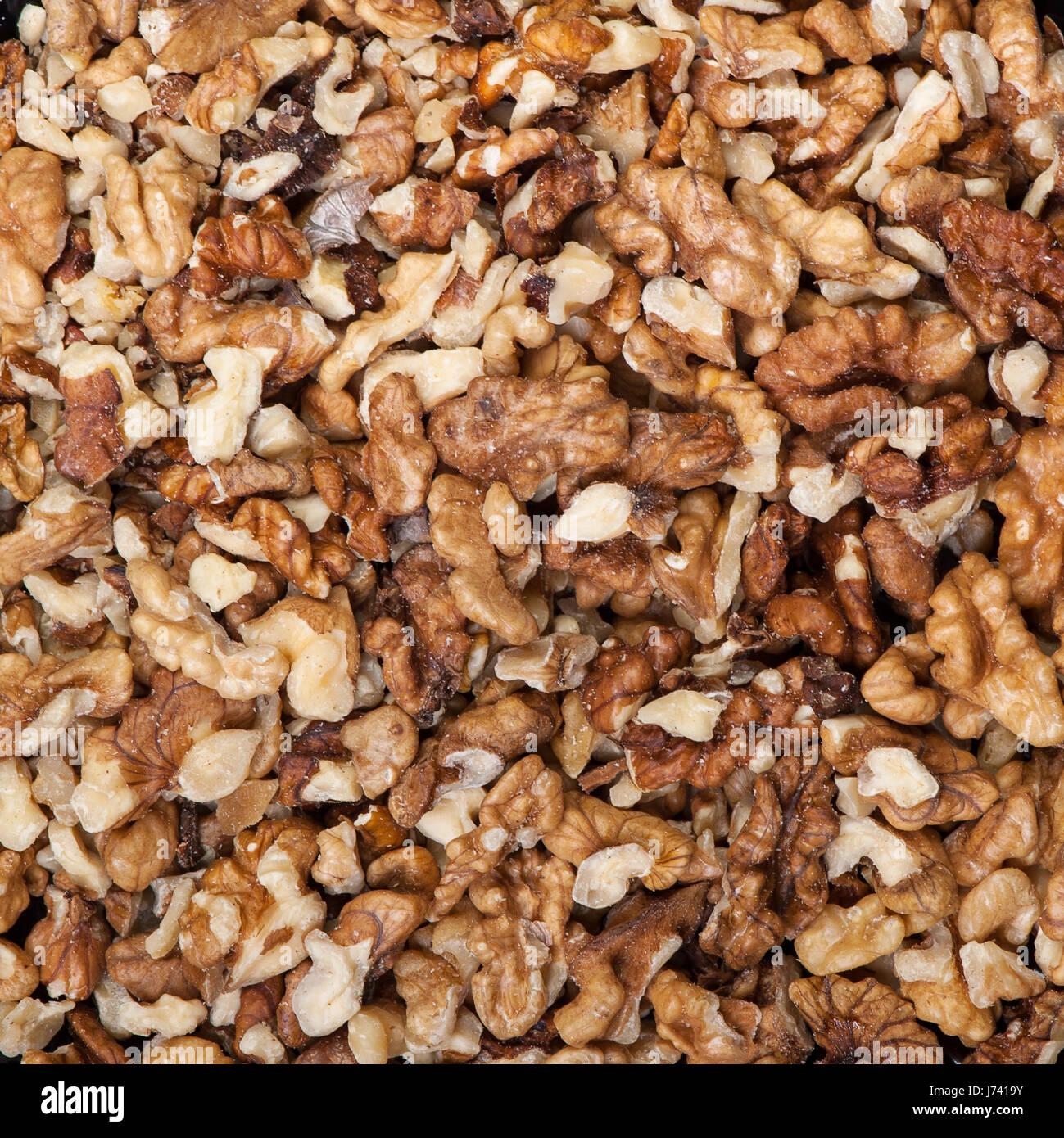 Closeup of peeled walnuts pile Stock Photo - Alamy