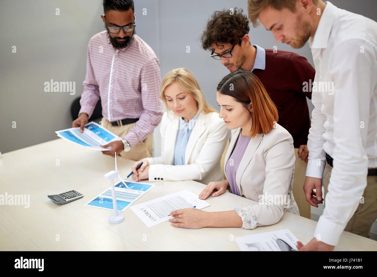 business people discussing green energy project Stock Photo - Alamy
