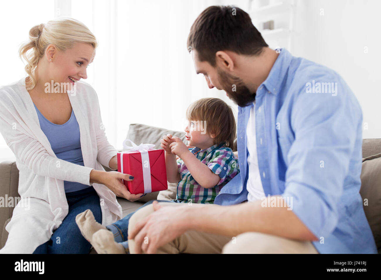 happy family with birthday gift at home Stock Photo - Alamy