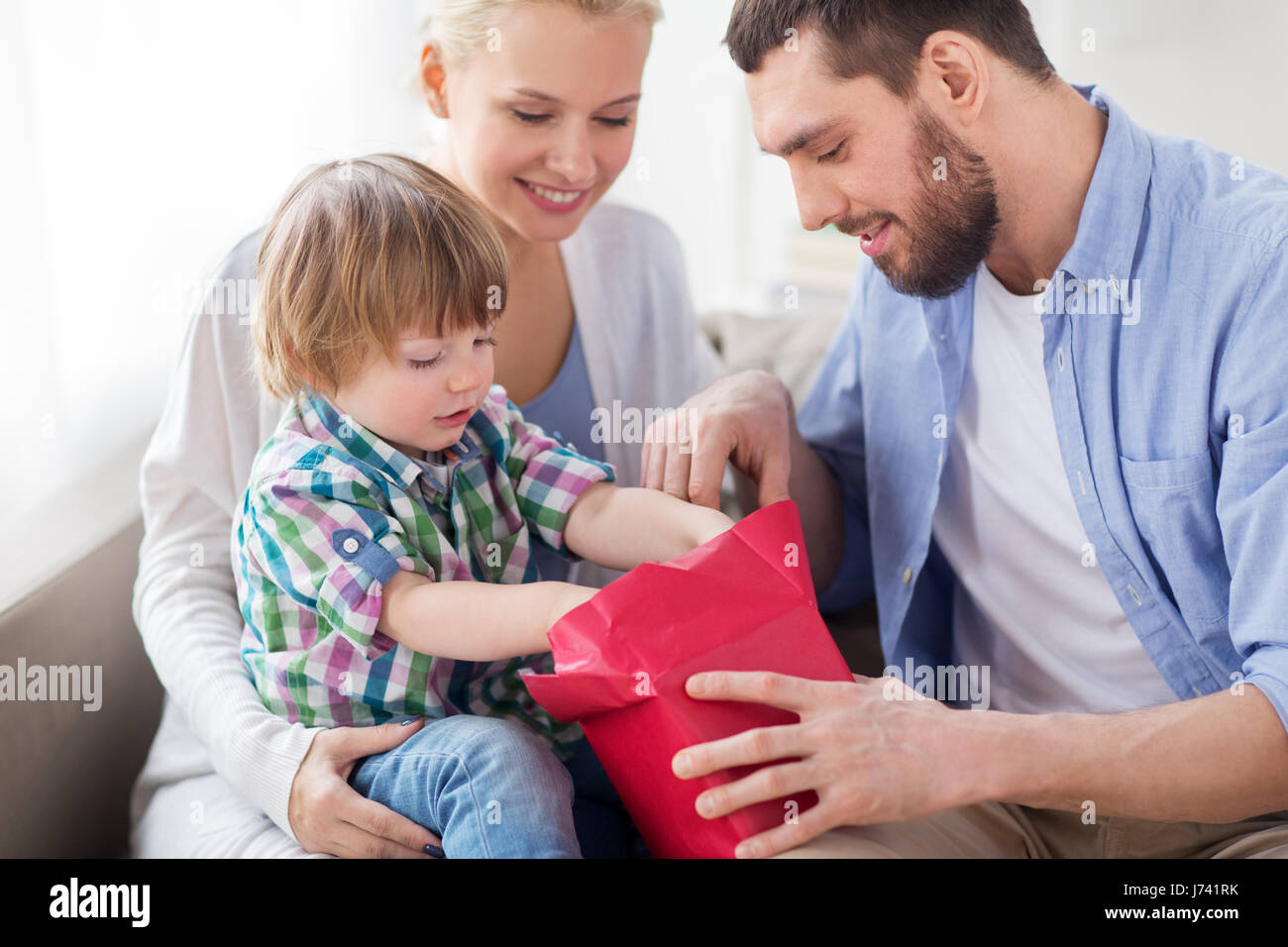 happy family with birthday gift at home Stock Photo - Alamy