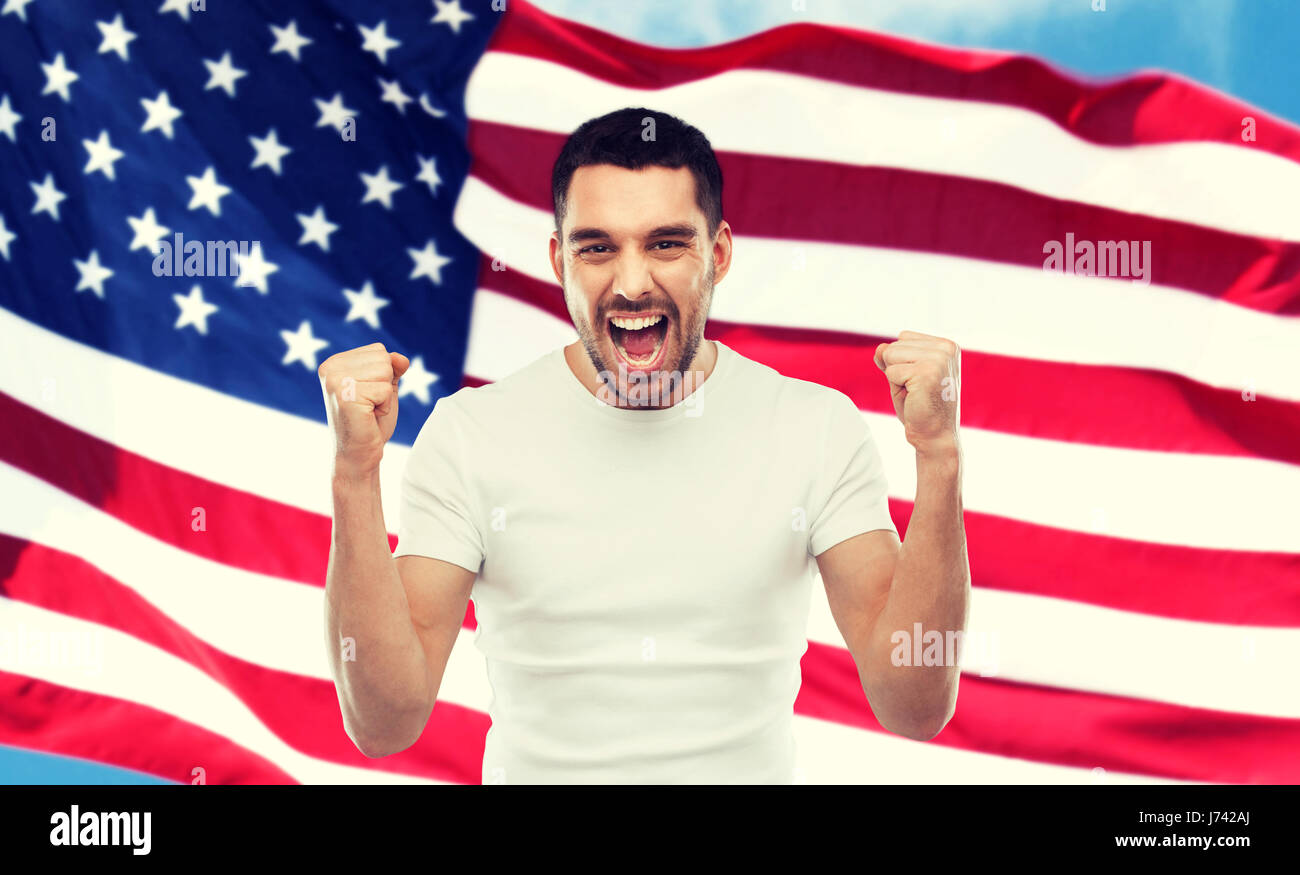 angry man showing fists over american flag Stock Photo - Alamy