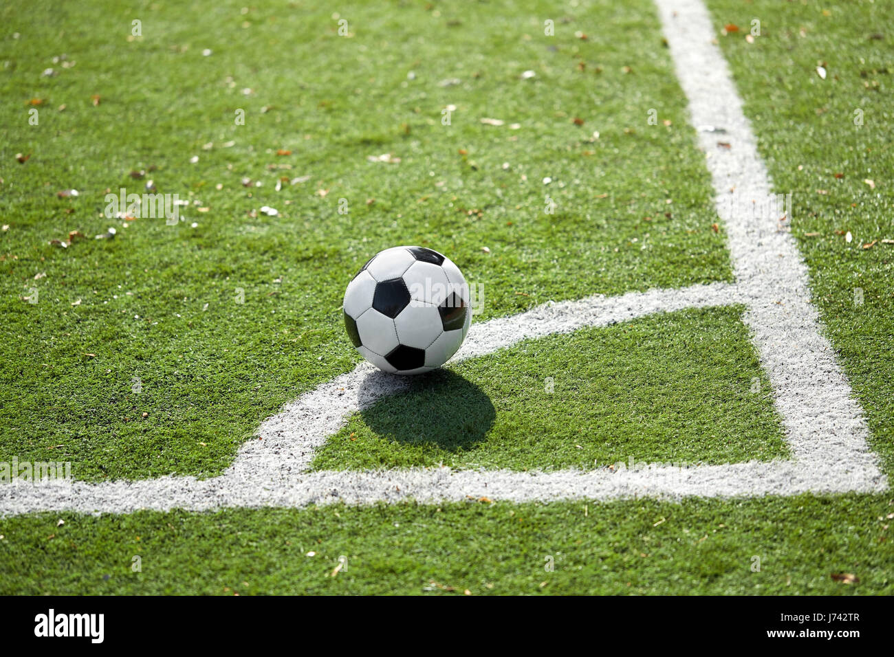 soccer ball on football field Stock Photo - Alamy