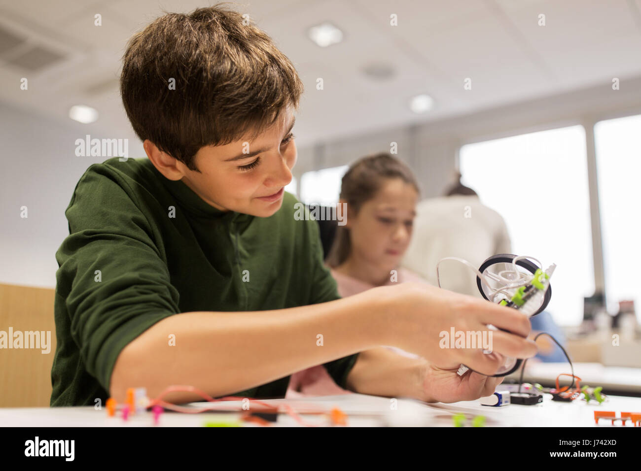 happy children building robot at robotics school Stock Photo - Alamy