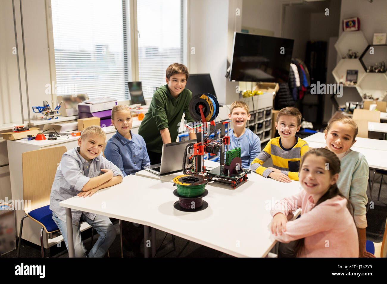 happy children with 3d printer at robotics school Stock Photo - Alamy