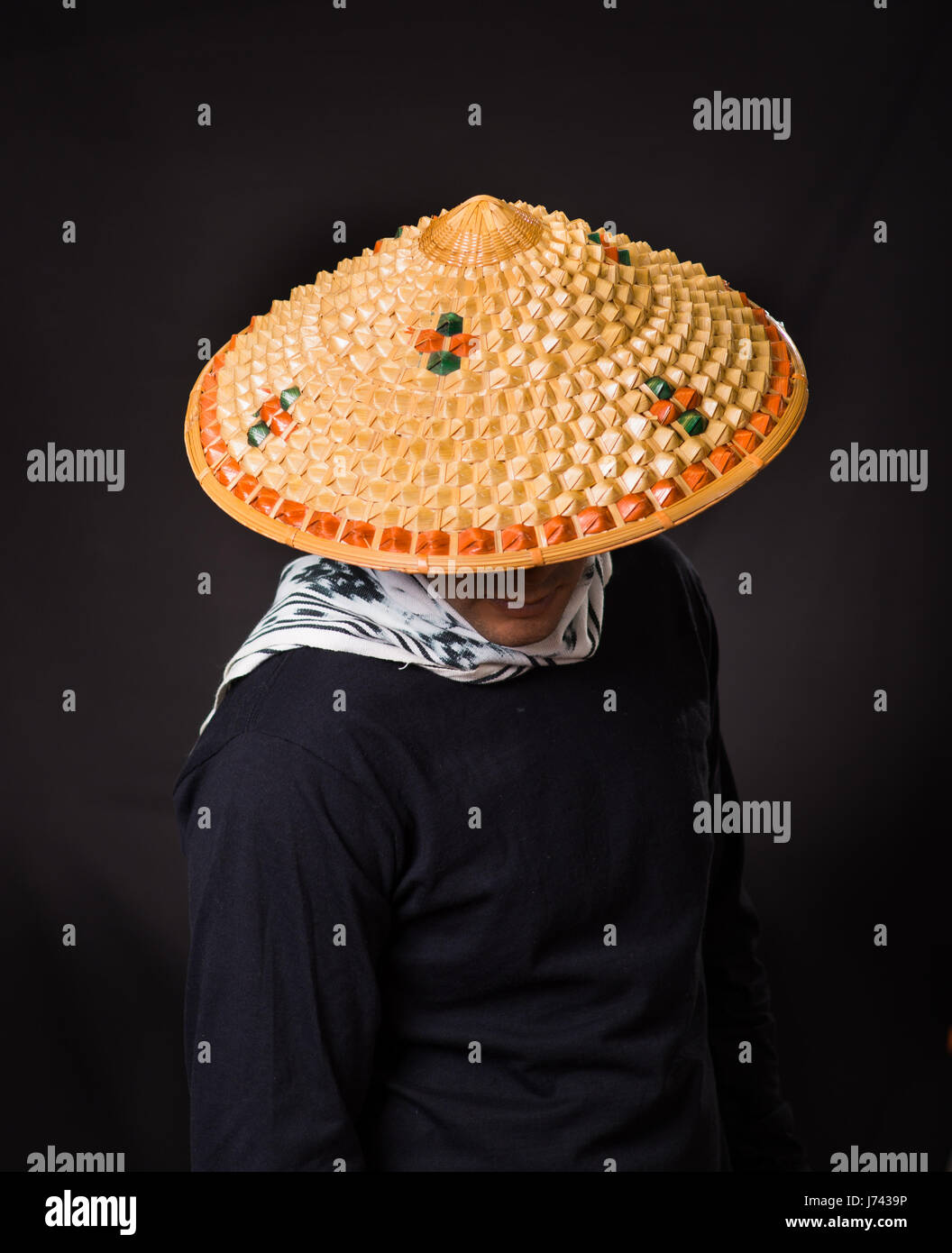 Portrait of a handsome hispanic young business guy wearing an asian ...