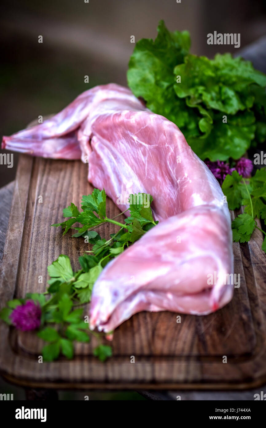 Raw fresh rabbit meat on wooden background Stock Photo - Alamy